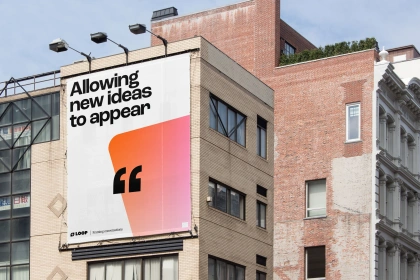 Laura - Large out of home billboard on a brick building showing loop ...